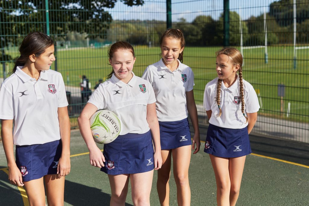 Netball - Girl with netball v7 | Woodhouse Grove School